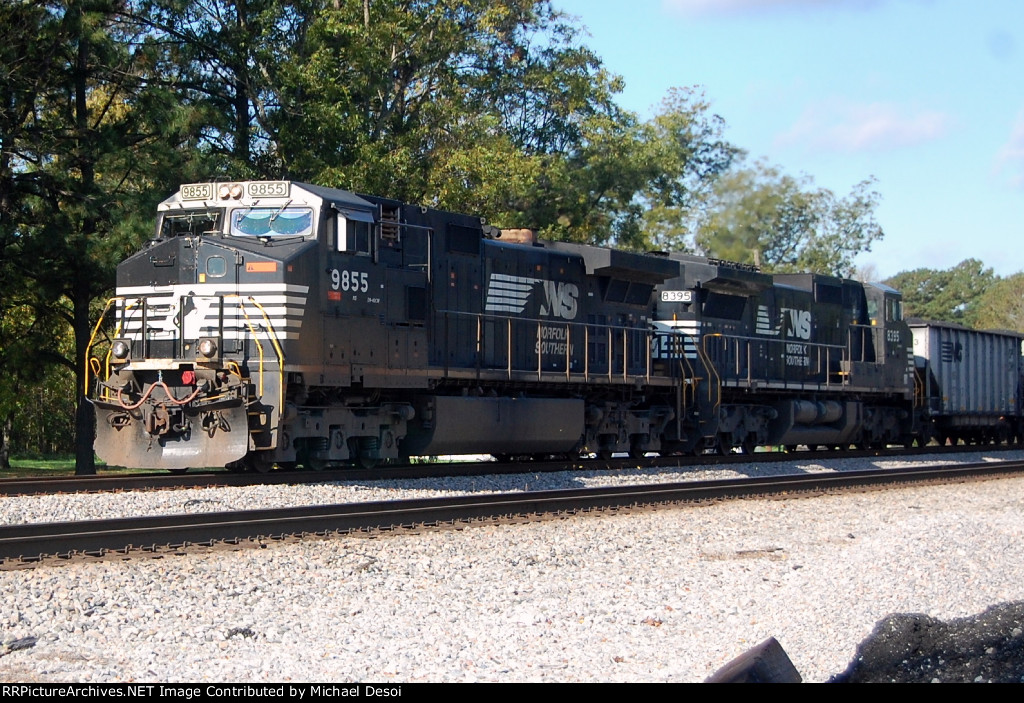 NS C40-9W #9855 is about to cross Main St. with an eastbound coal train